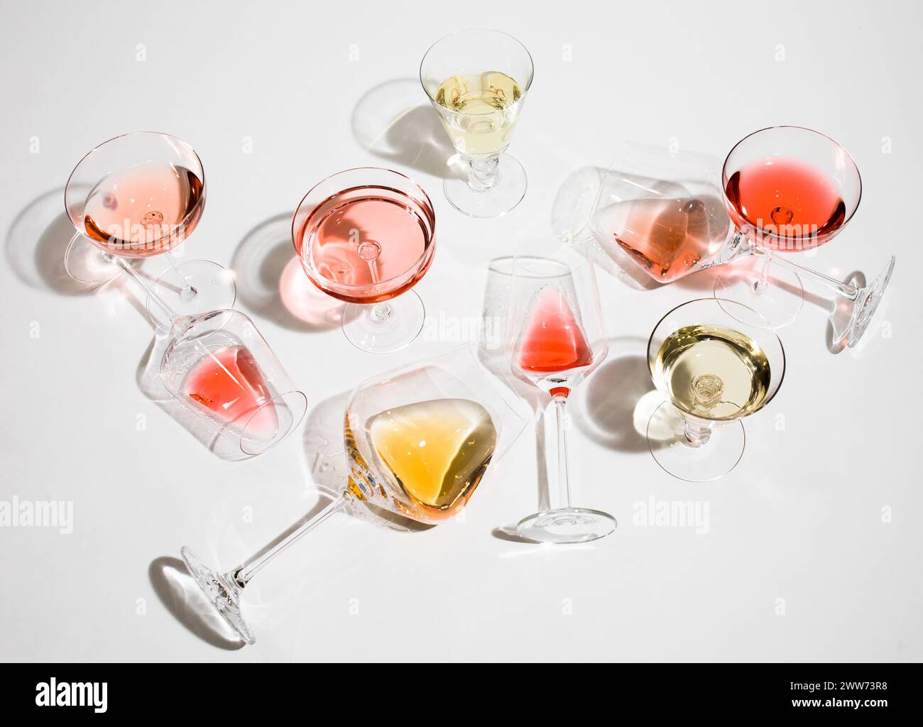 Wine glasses tipped over with red, white, orange and rose wine Stock ...