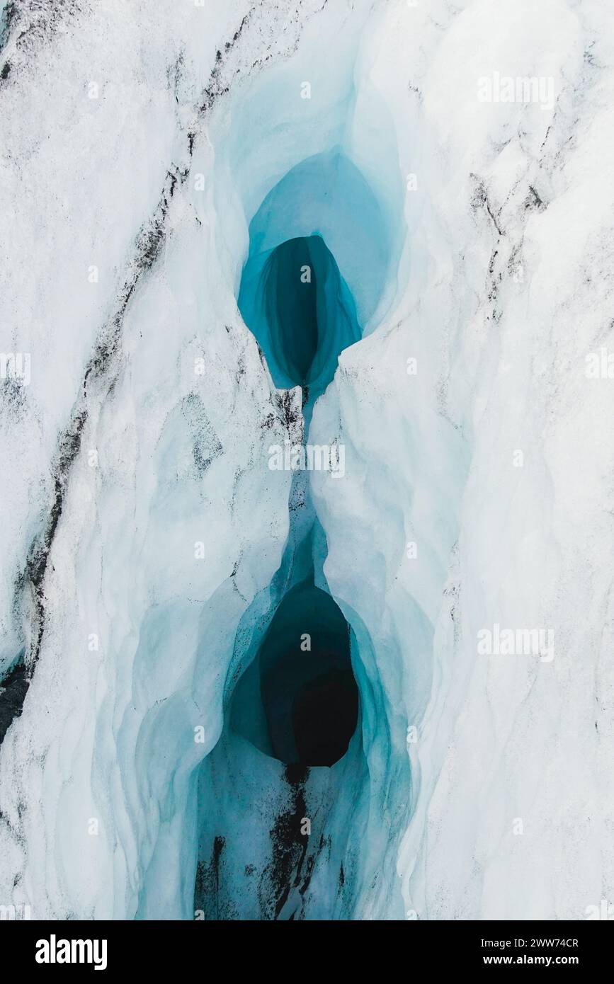 Deep and dark blue ice tunnels on an Icelandic glacier Stock Photo - Alamy