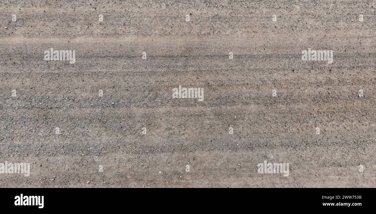 view from above on texture of gravel road with car tire tracks Stock ...