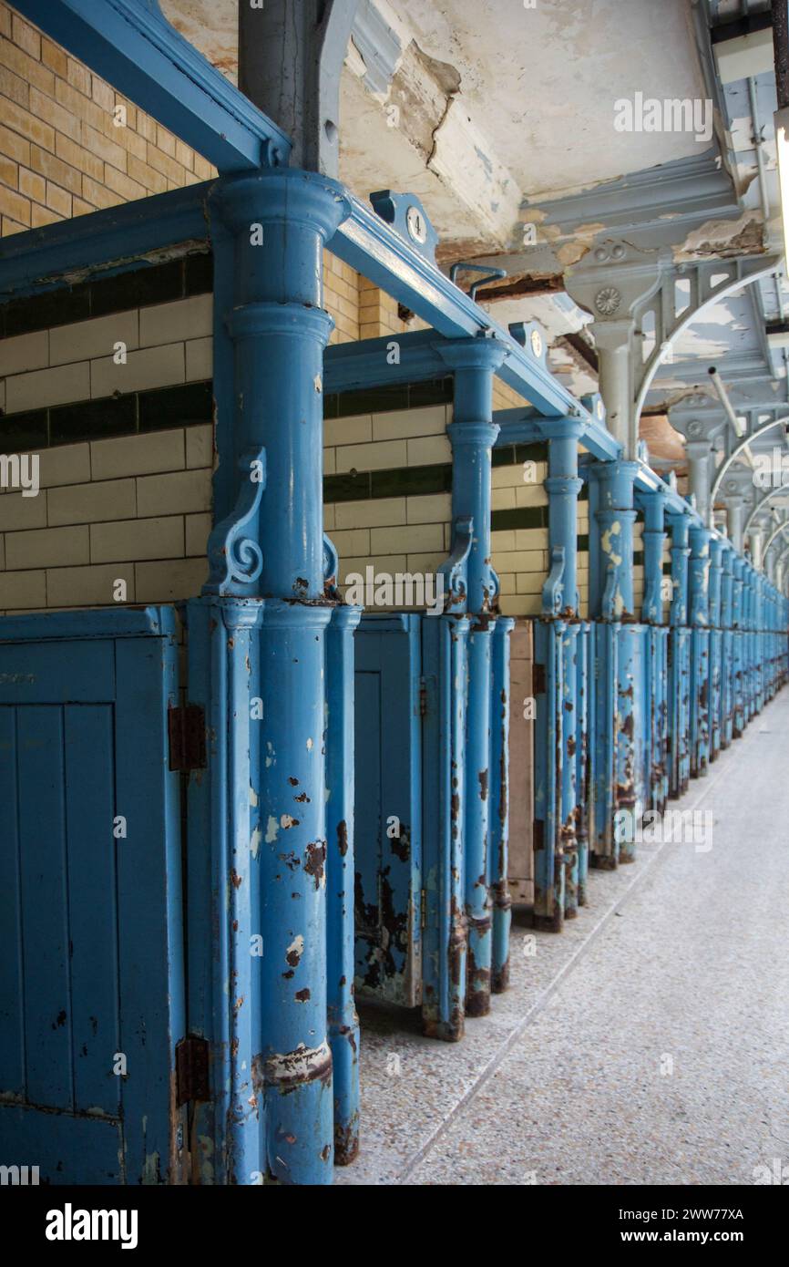 Old and rusting poolside changing rooms / cubicles at the disused ...