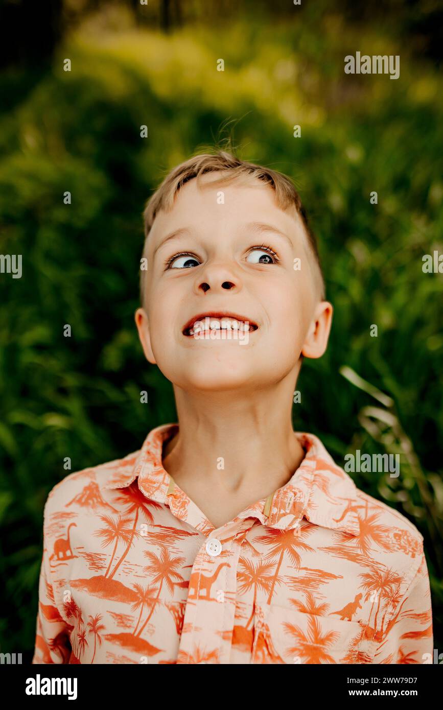 A young boy posing with a silly face Stock Photo - Alamy