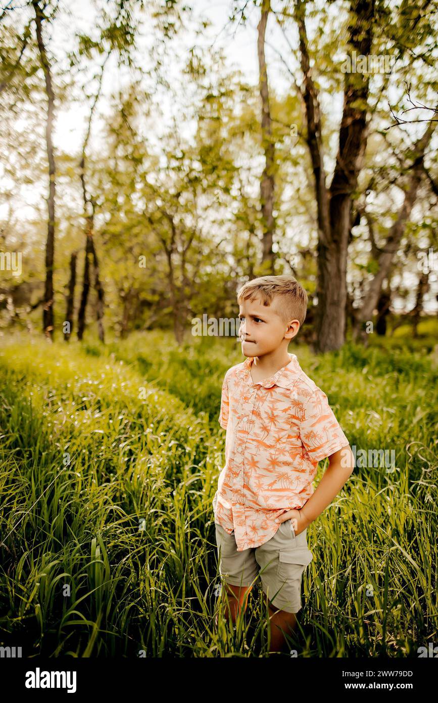 A young boy contemplating in the woods Stock Photo - Alamy