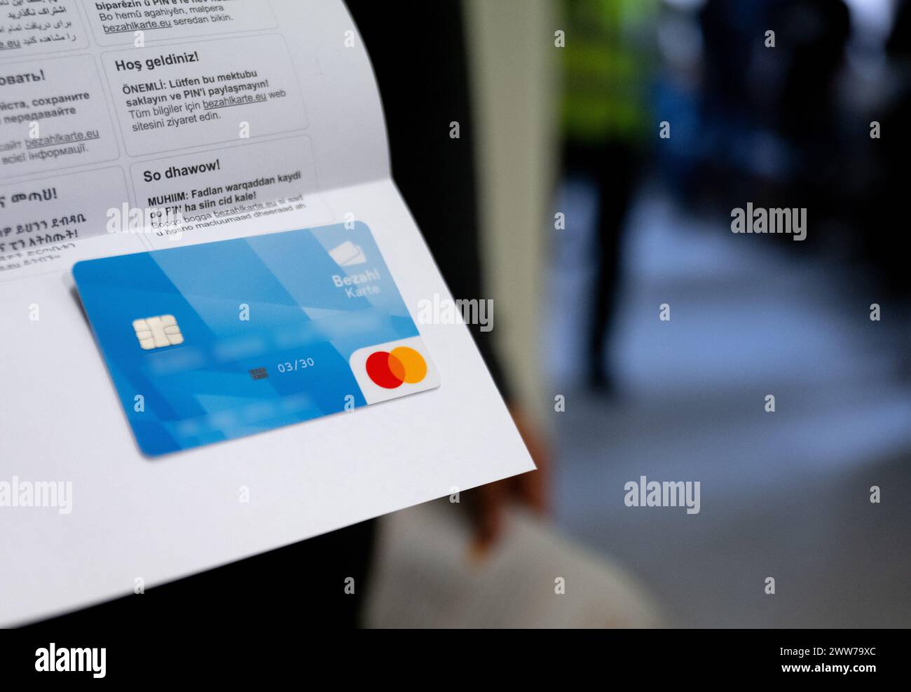 22 March 2024, Bavaria, Fürstenfeldbruck: An asylum seeker shows one of ...