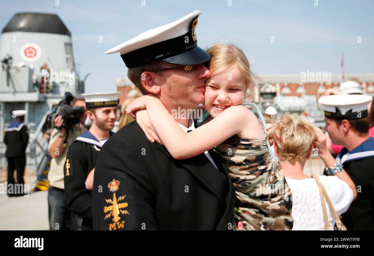 04/07/11.Pictured: Petty Officer Scott Barnes is welcomed home by his ...