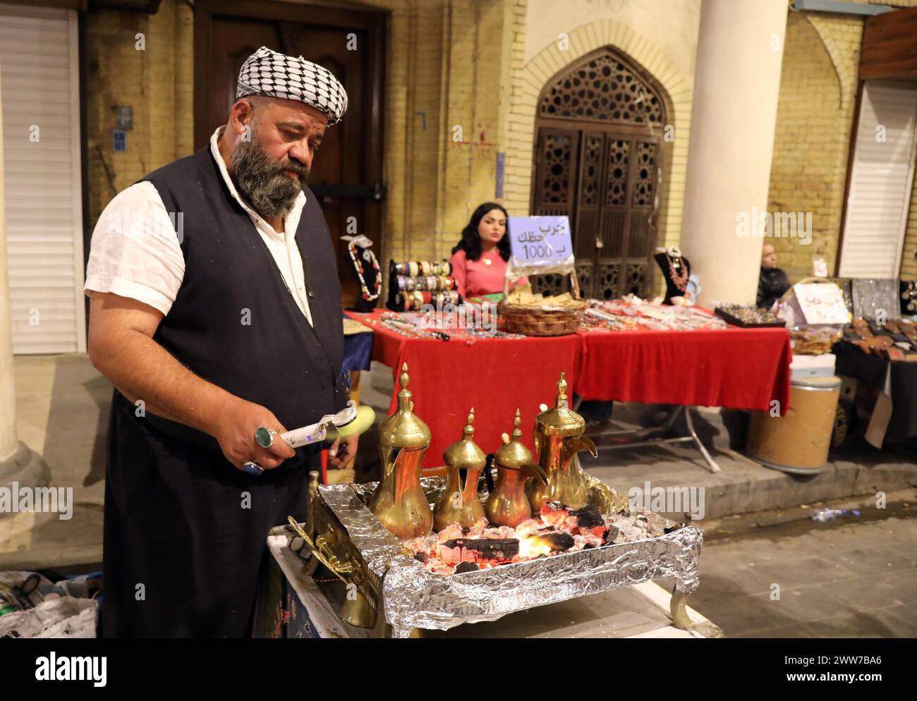 Baghdad, Iraq. 21st Mar, 2024. A man sells traditional Arabic coffee ...