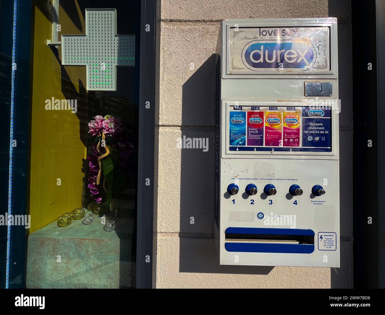 Meudon, France. 22nd Mar, 2024. Illustration of a condom dispenser and condoms in a supermarket ...