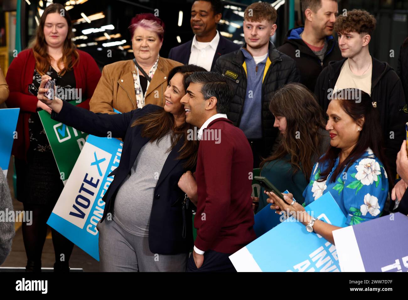 Prime Minister Rishi Sunak has his photo taken with employees during a ...