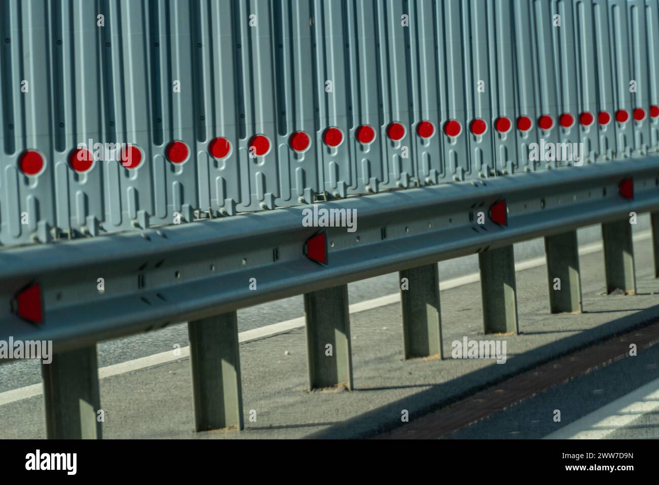 Safety barriers on highway. Anodized safety steel barrier. Enhancing ...