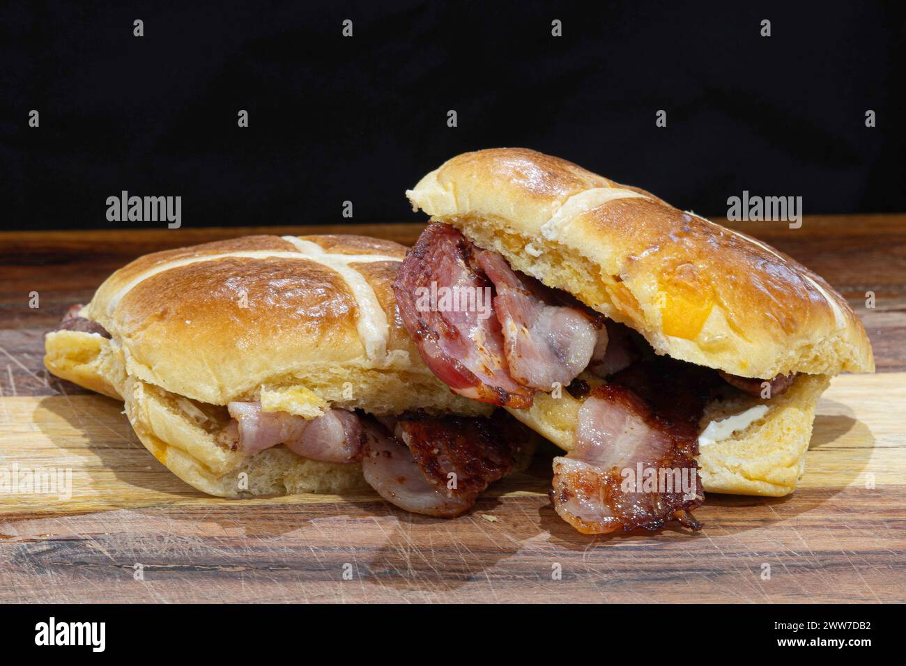 Traditional Cheesy Hot Cross Buns made into a bacon sandwich for Easter ...