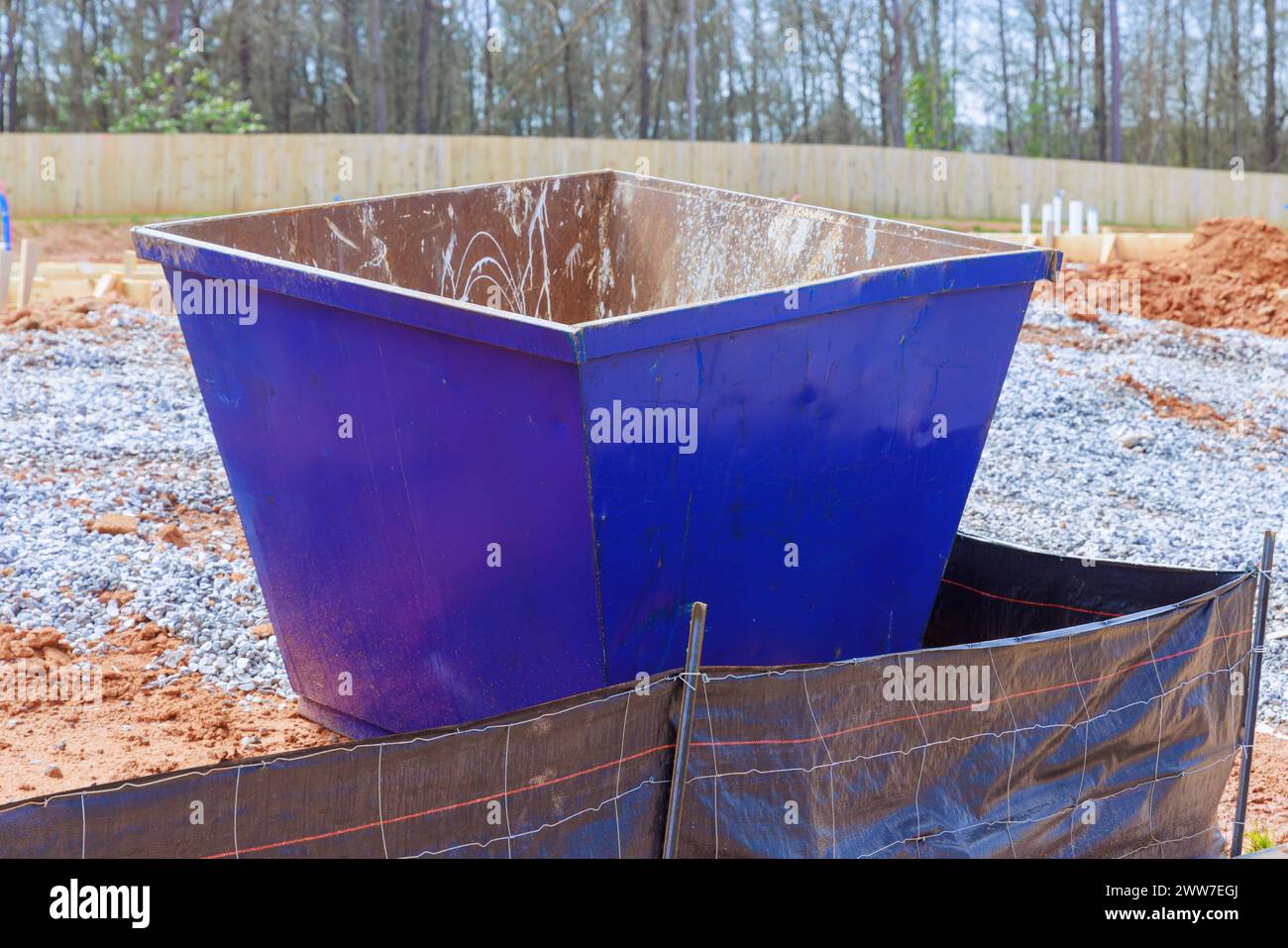 Construction junk recycling waste stored in metal container dumpster ...