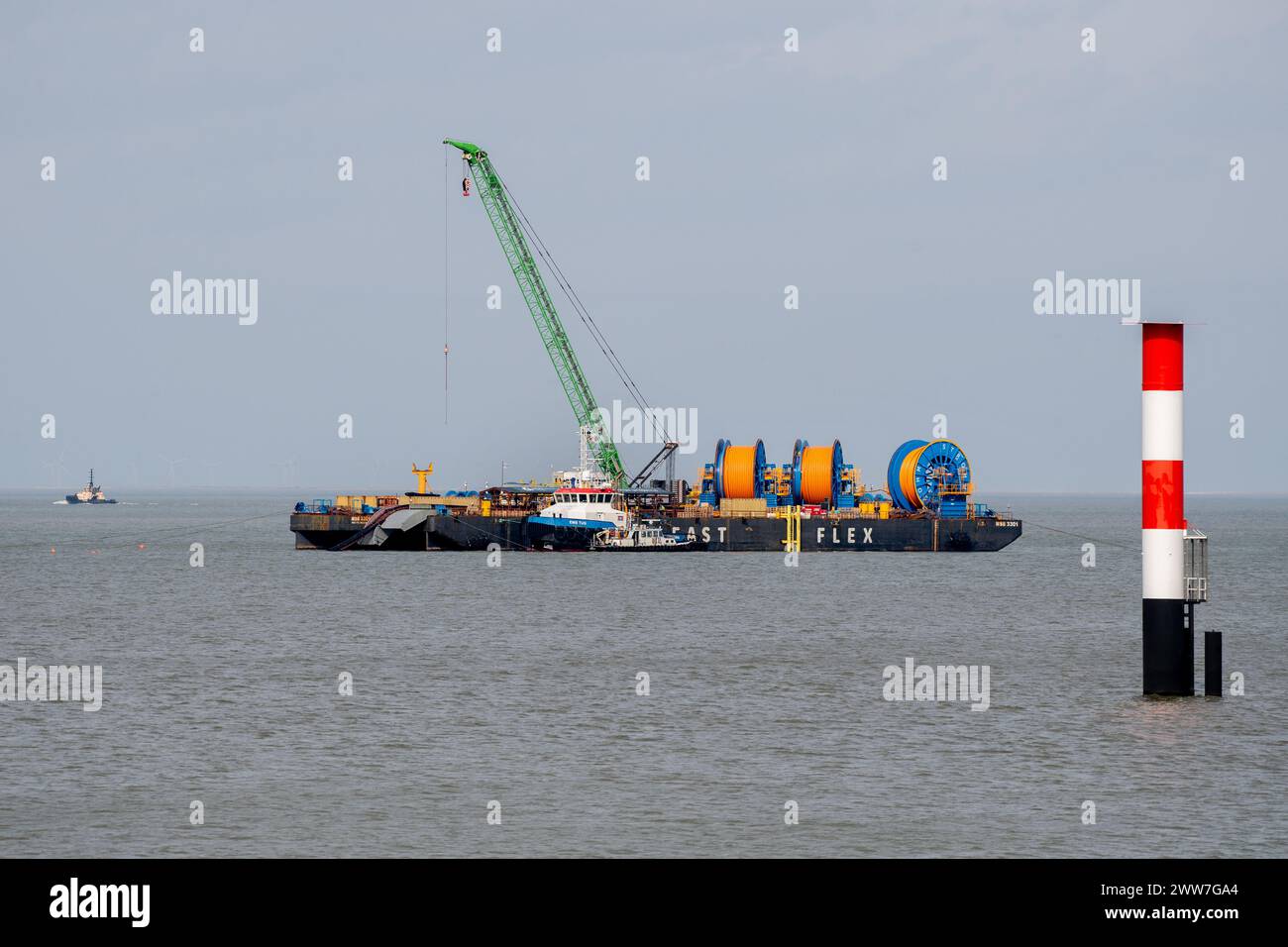 PRODUCTION - 14 March 2024, Lower Saxony, Wilhelmshaven: A workboat is in use during ...