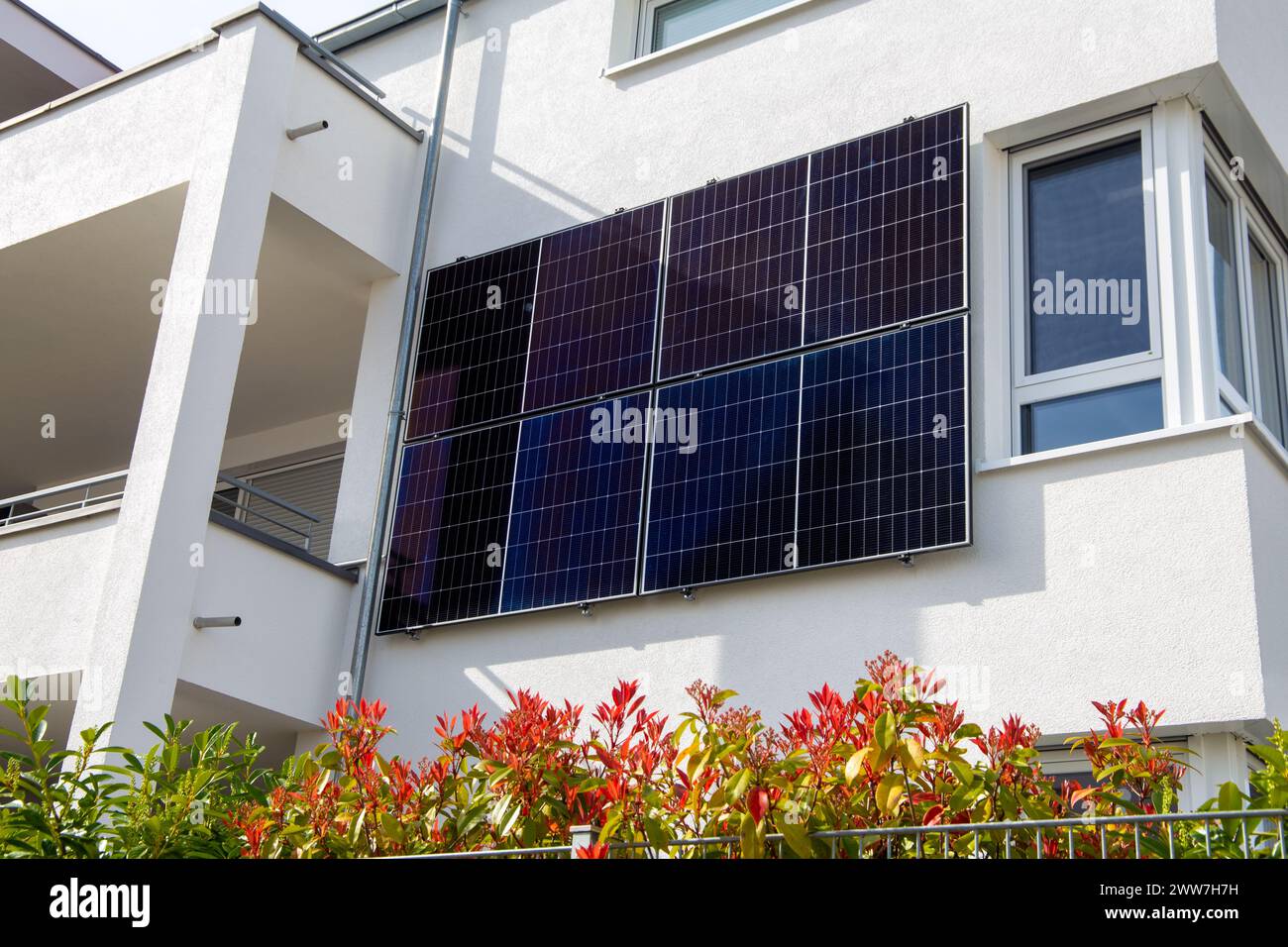 New residential building with solar modules on the facade Stock Photo ...
