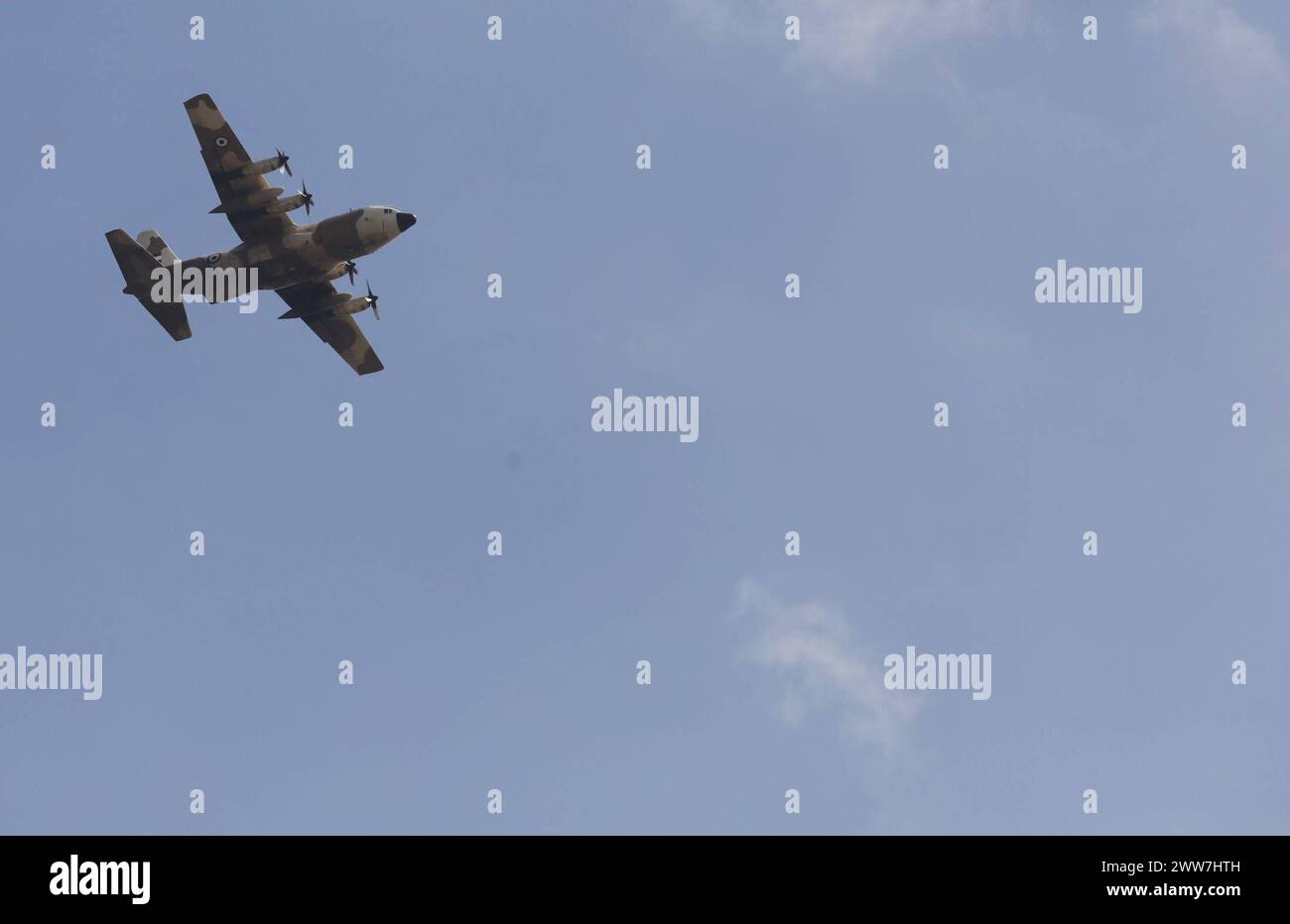 Humanitarian aid packages are seen landing by the help of parachutes ...