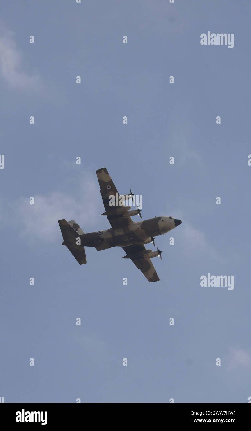 Humanitarian aid packages are seen landing by the help of parachutes ...