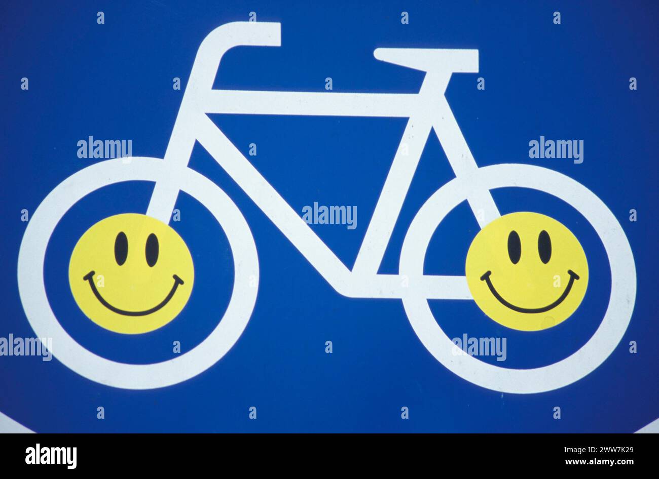 Bicycle lane sign with smiling faces smileys Stock Photo - Alamy