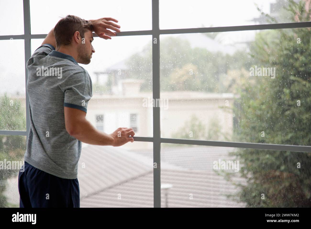 Man longing looking window hi-res stock photography and images - Alamy