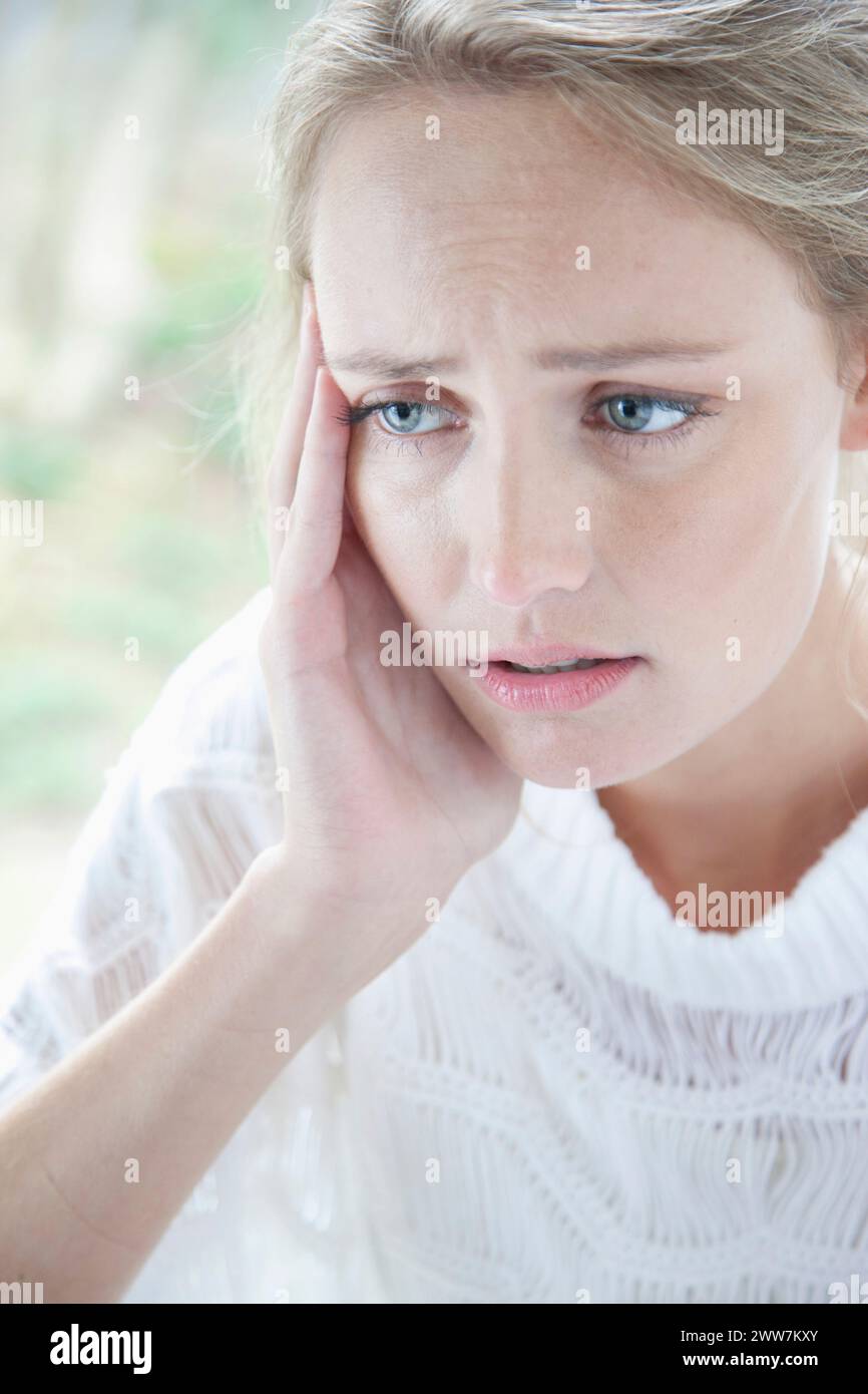 Portrait of Concerned Young Woman Stock Photo - Alamy