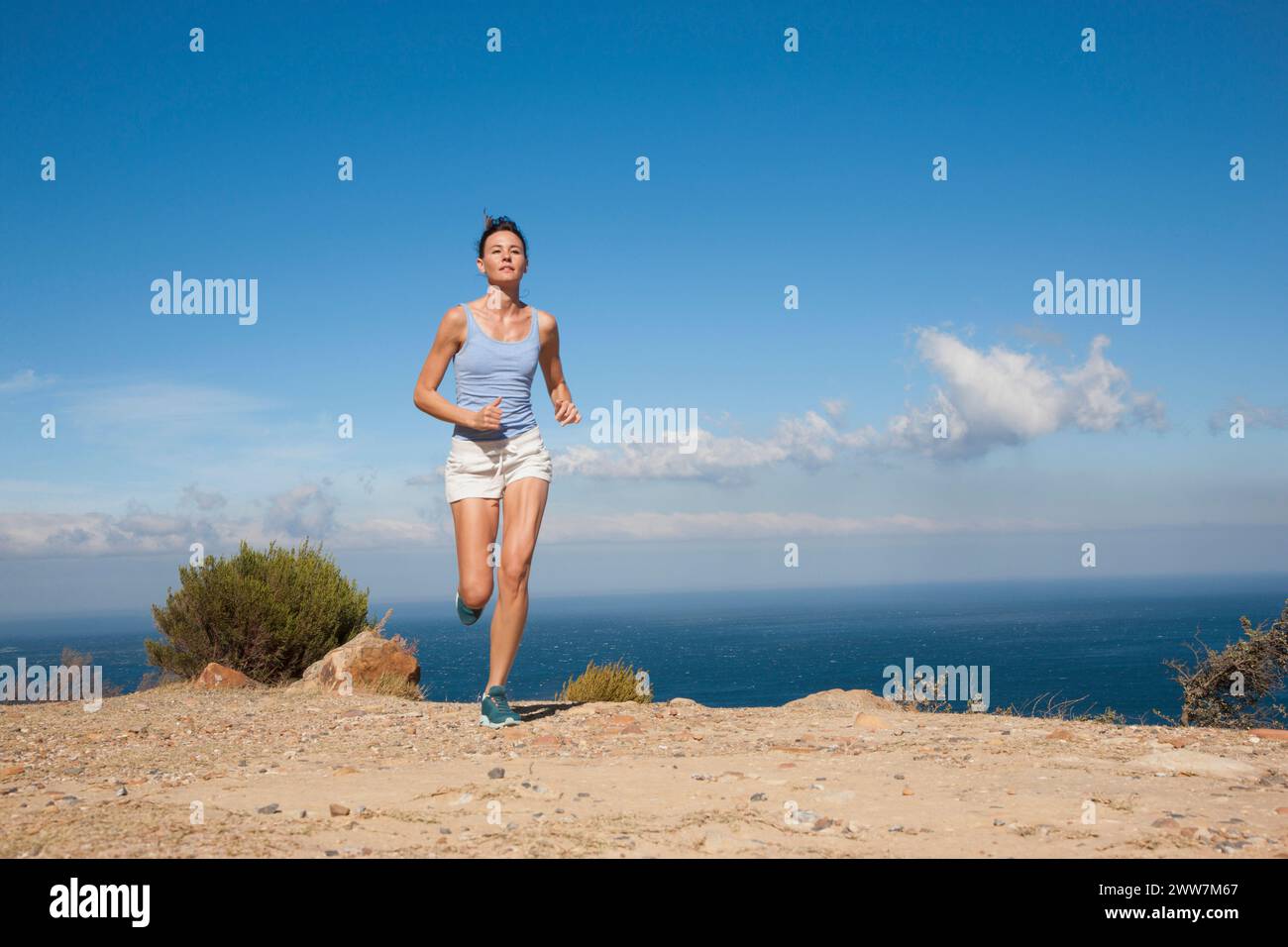 Young woman running out sea hi-res stock photography and images - Alamy