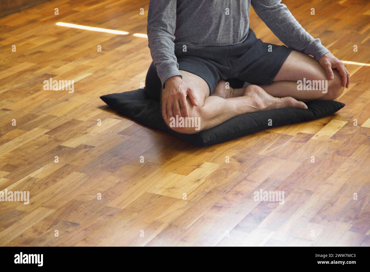 Mature Man Practicing Yoga, Easy Pose, Low Section Stock Photo - Alamy