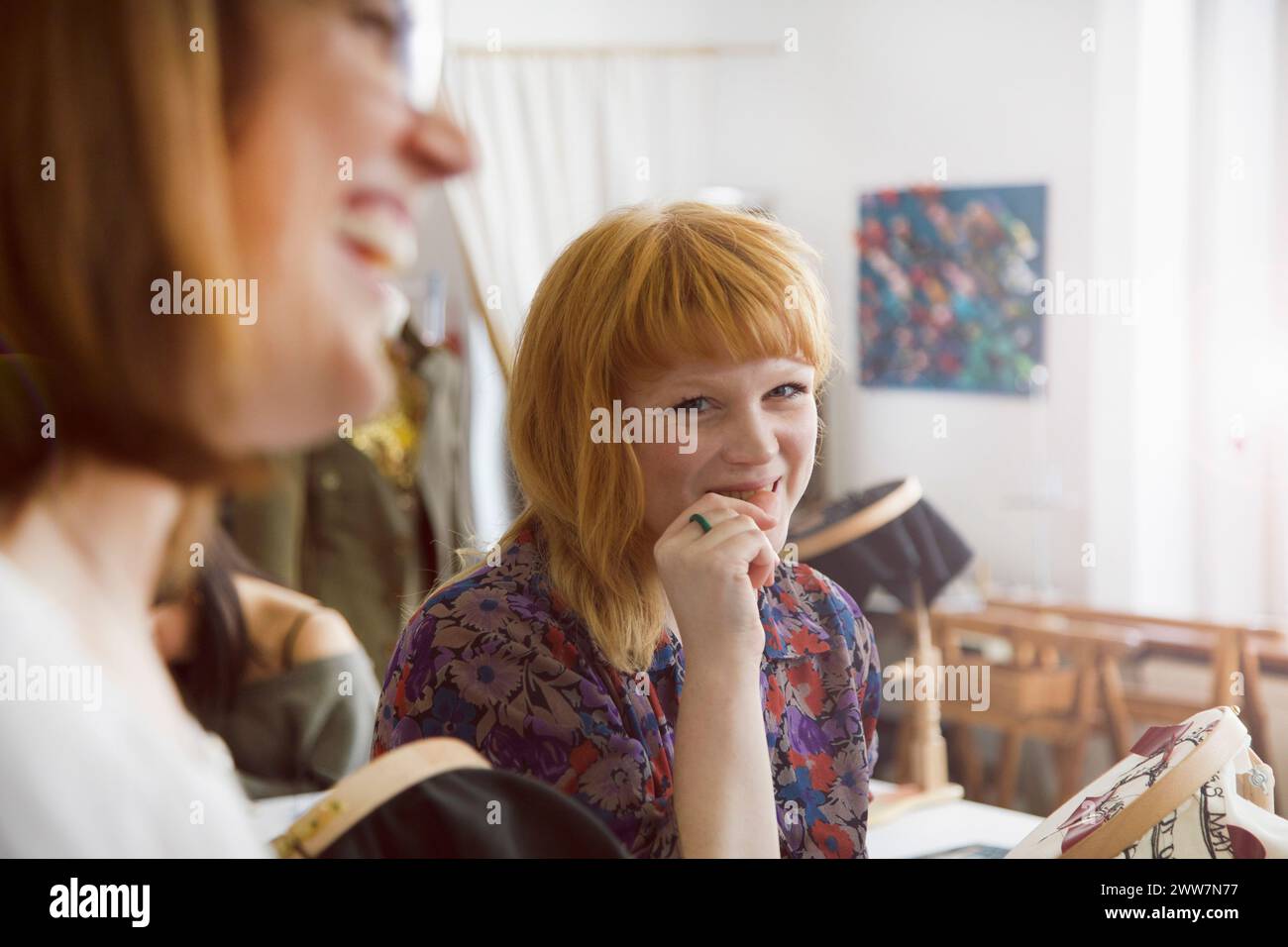 Smiling Female Employee at Embroidery Design Studio Stock Photo - Alamy