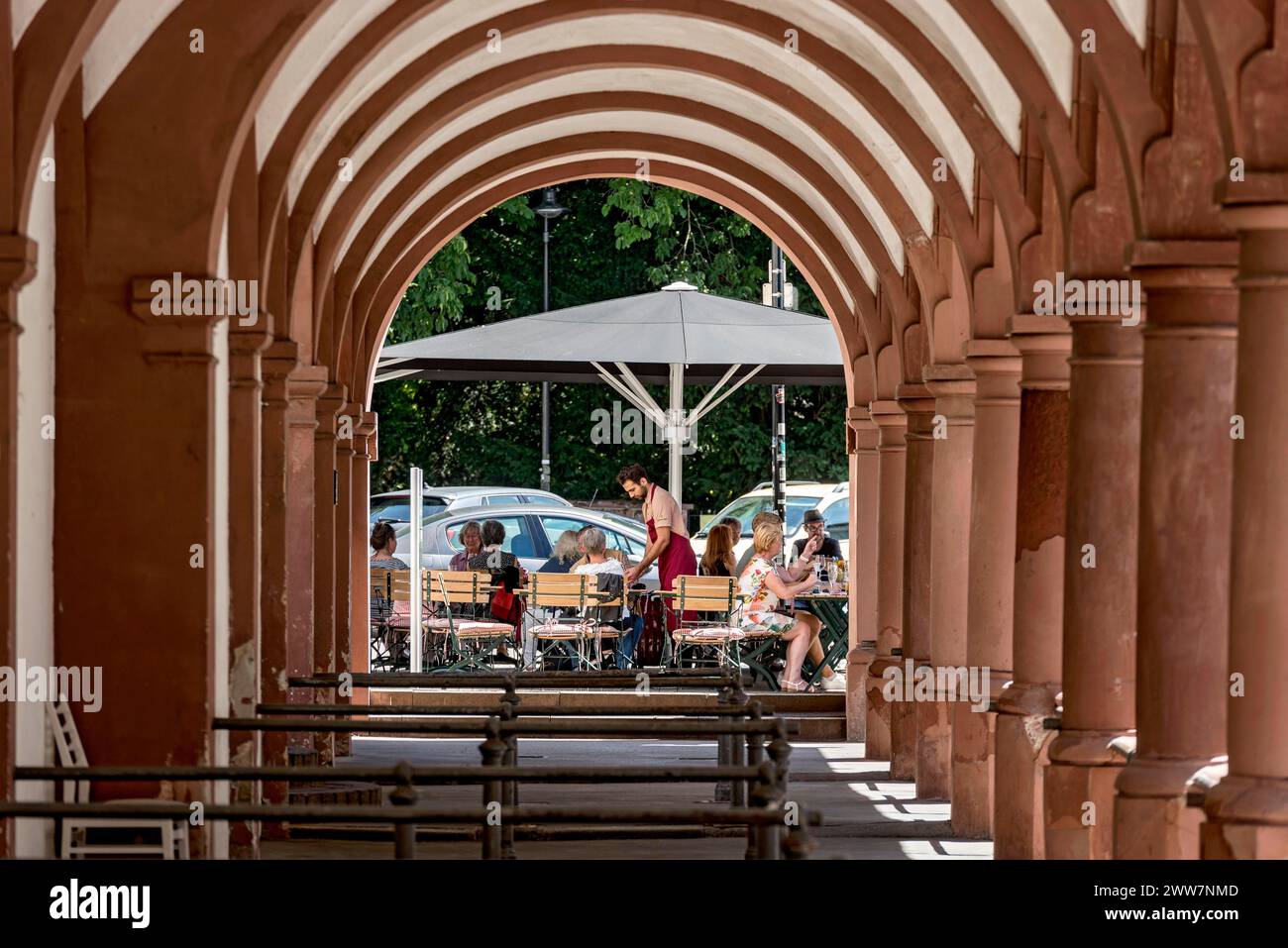 Restaurant and street cafe with waiter and guests, historic market ...