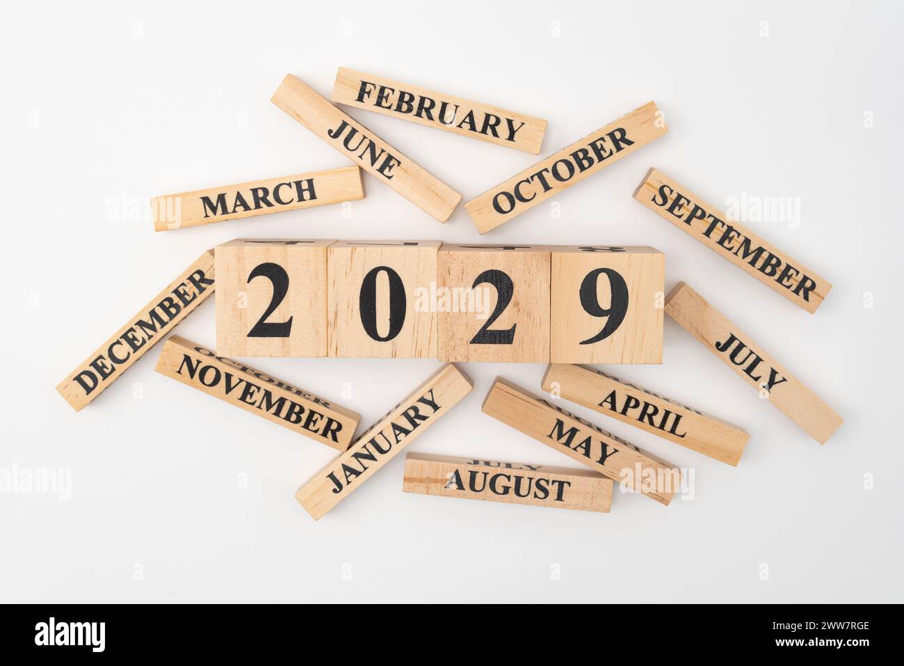 Wooden blocks and cubes with the year 2029 and the 12 months of the ...
