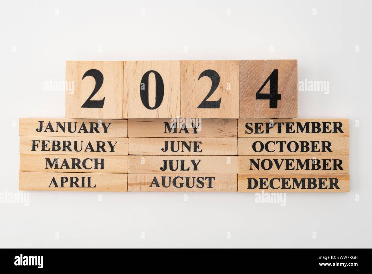 Year 2024 written on wooden cubes on top of the months of the year ...
