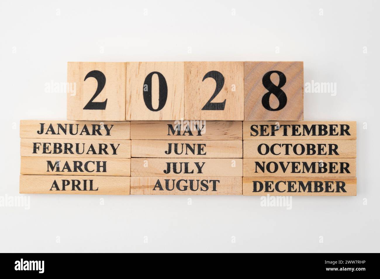 Year 2028 written on wooden cubes on top of the months of the year ...