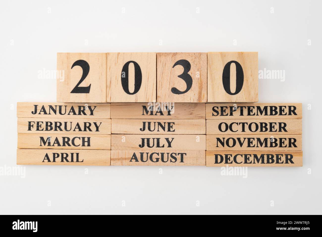 Year 2030 written on wooden cubes on top of the months of the year ...