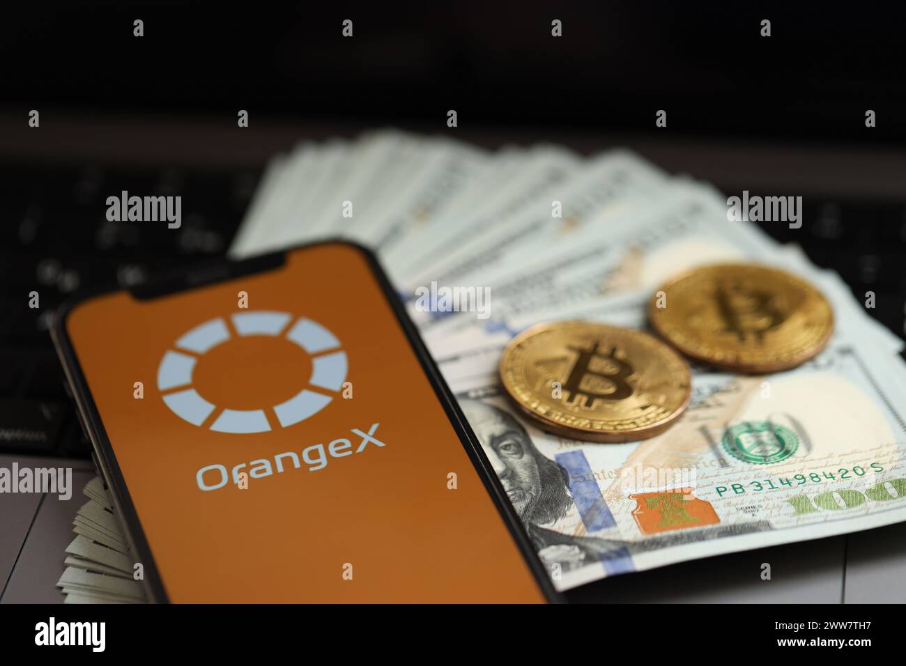 KYIV, UKRAINE - MARCH 15, 2024 OrangeX logo on iPhone display screen ...