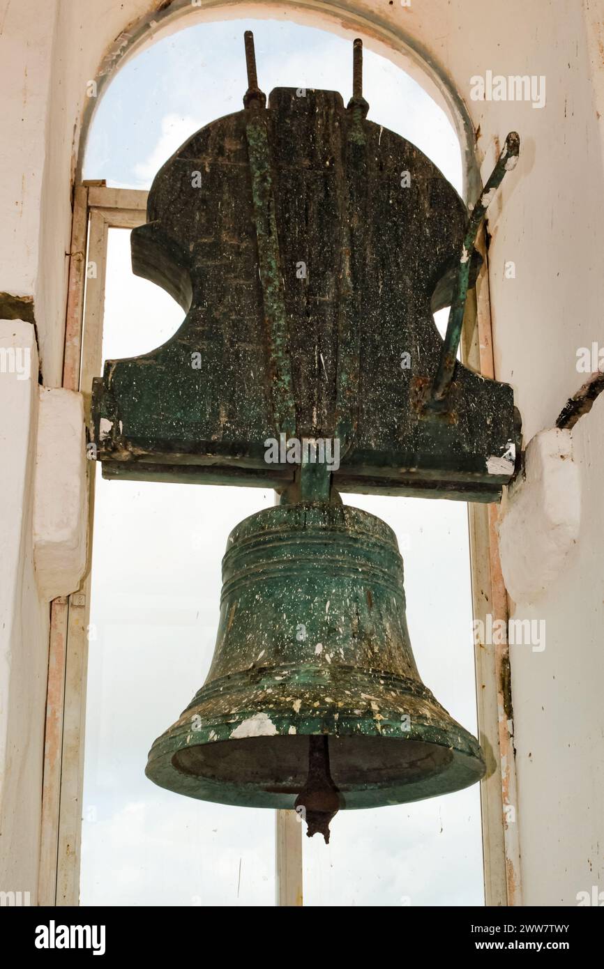 Ancient bell painted green on the church tower Stock Photo - Alamy