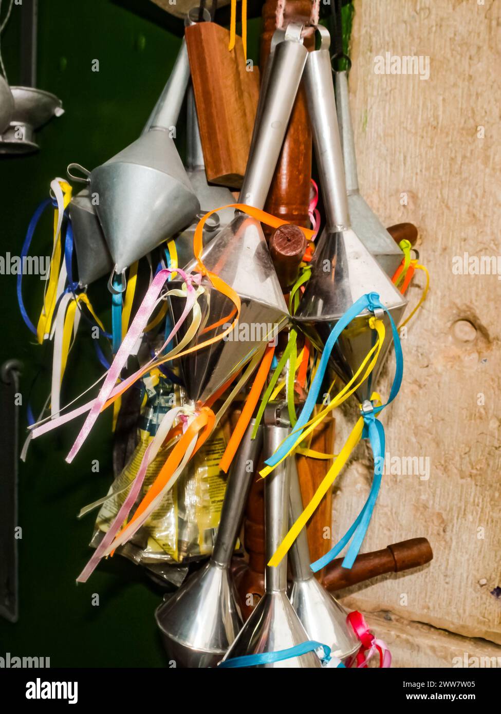 Some metal maracas decorated with colorful ribbons, a percussion ...