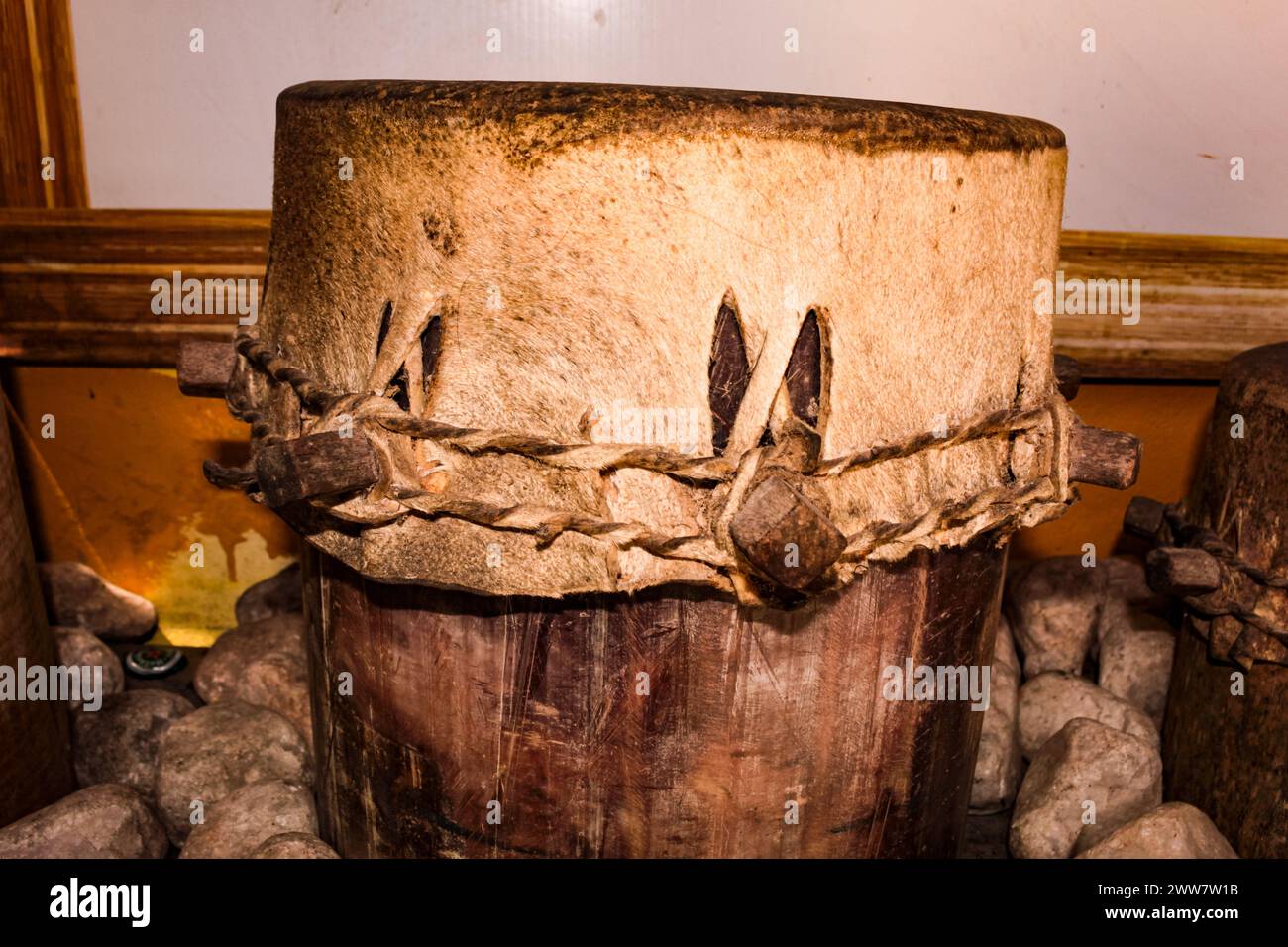 Rustic drum, made of hollow trunk and animal skin, used in the ...