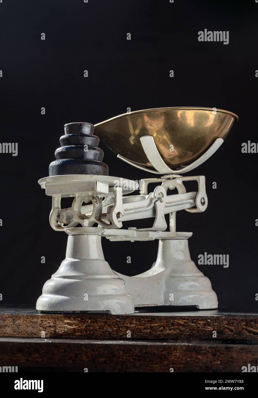 Classic weight scale Isolated on dark background. Old obsolete manual ...