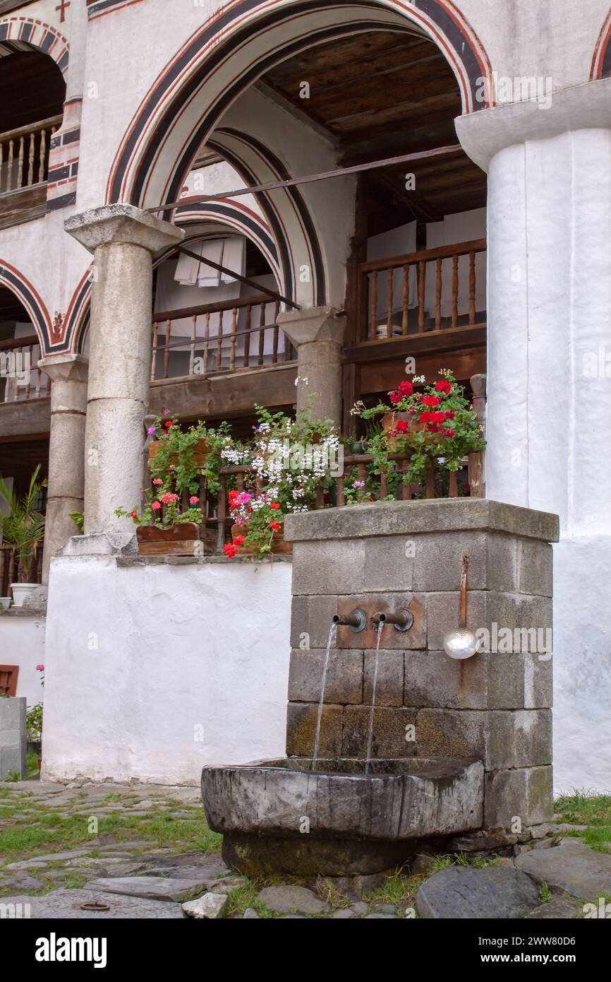 Old stone fountain with two spouts, in the Medieval style Stock Photo ...