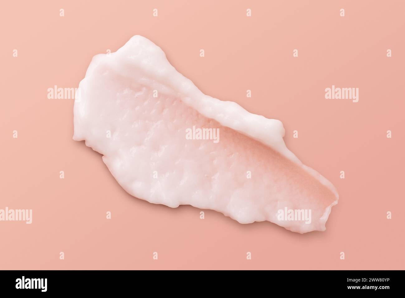 Cosmetic smear of white creamy texture on a beige background. Face ...