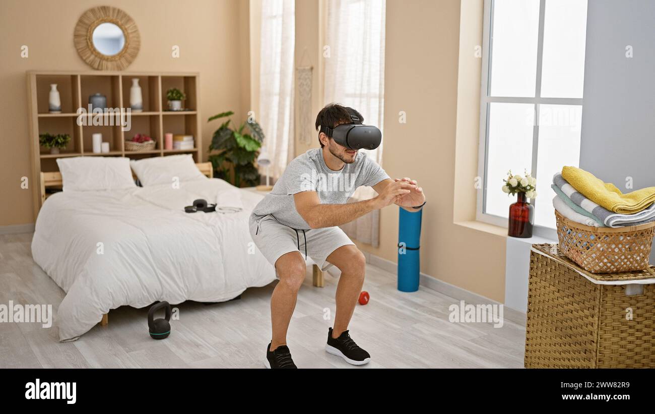 A young man experiences virtual reality in a modern bedroom setting ...