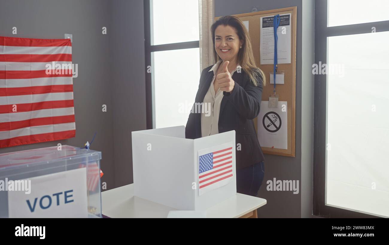 A smiling hispanic woman gives thumbs up at a us electoral college ...