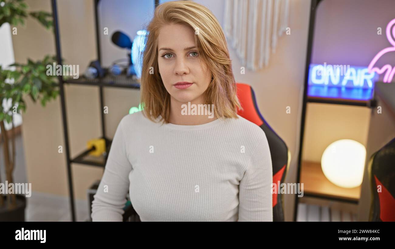 A professional female streamer in a gaming room with modern equipment ...