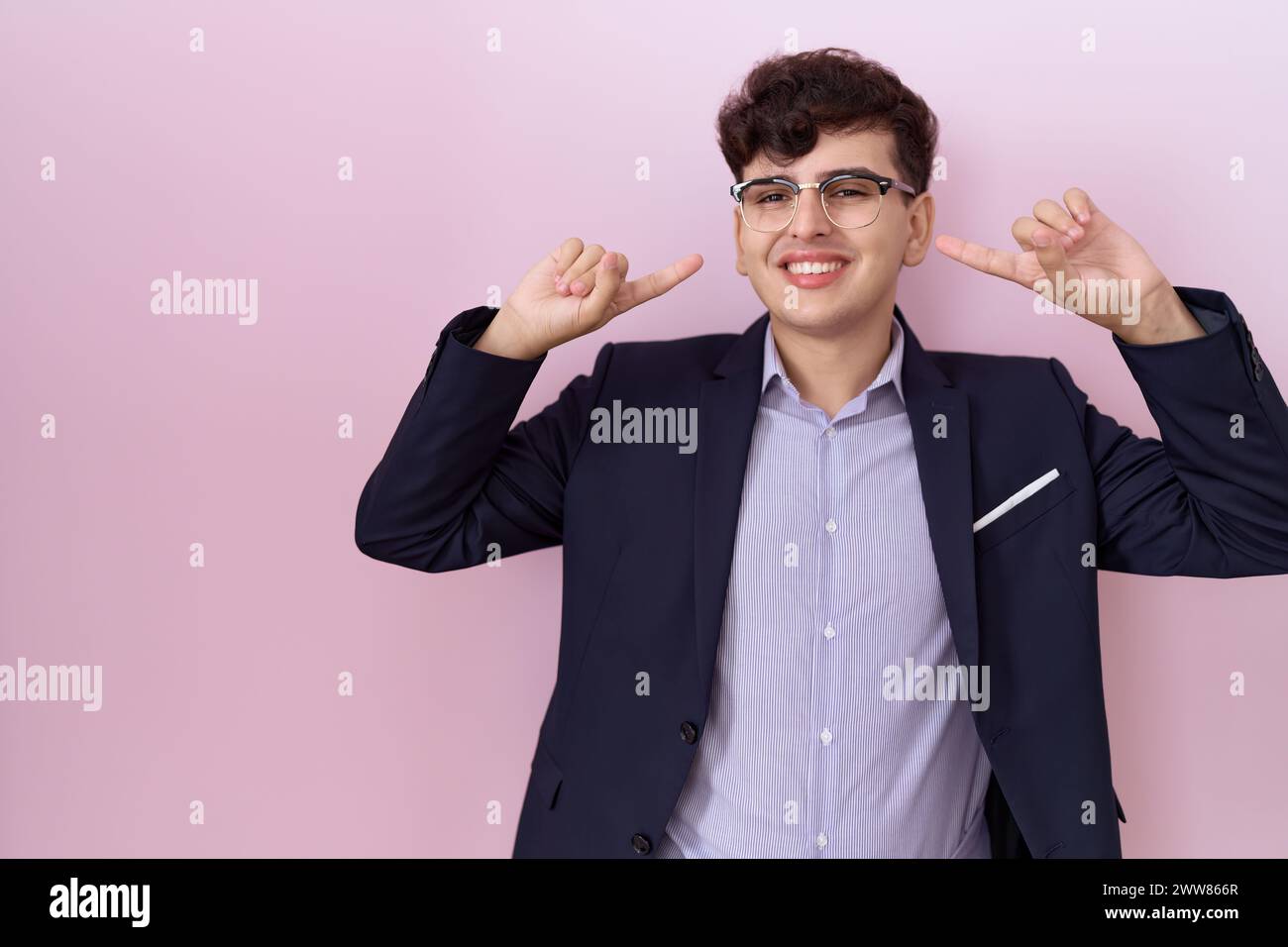 Young non binary man with beard wearing suit and tie smiling cheerful ...