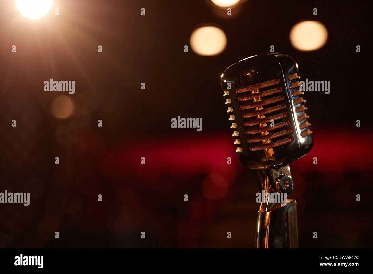 Closeup background image of metal retro microphone on stage with ...