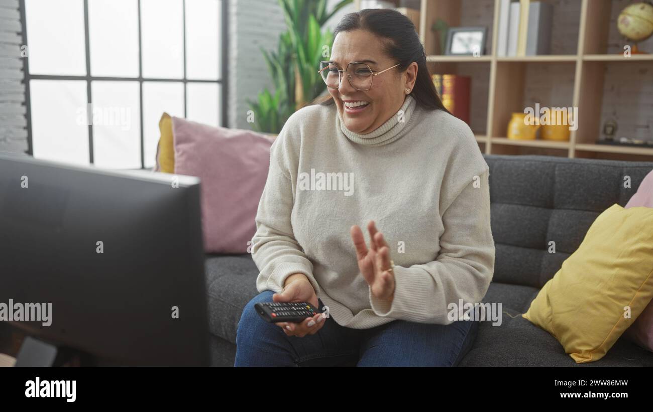 Woman in glasses enjoying tv hi-res stock photography and images - Alamy