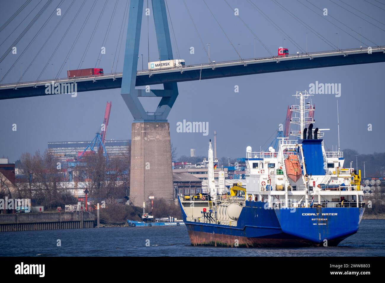 The Köhlbrand Bridge in the port of Hamburg, tanker Cobalt Water, spans ...