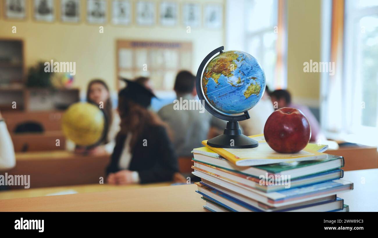 A globe of the world in a school classroom during a lesson. The globe ...