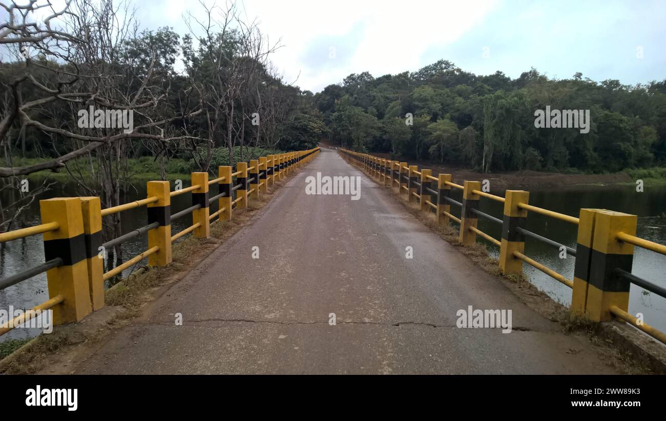A narrow bridge over a river in India Stock Photo - Alamy