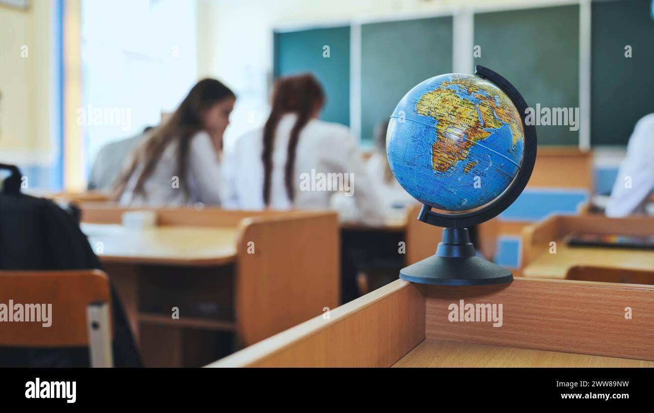 A globe of the world in a school classroom during a lesson Stock Photo ...