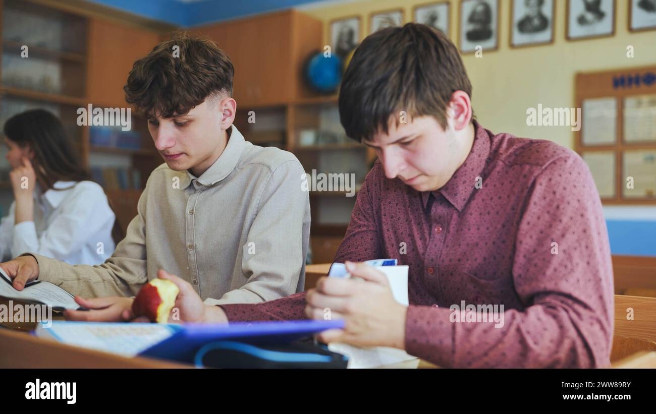 Schoolboys desk during class hi-res stock photography and images - Alamy