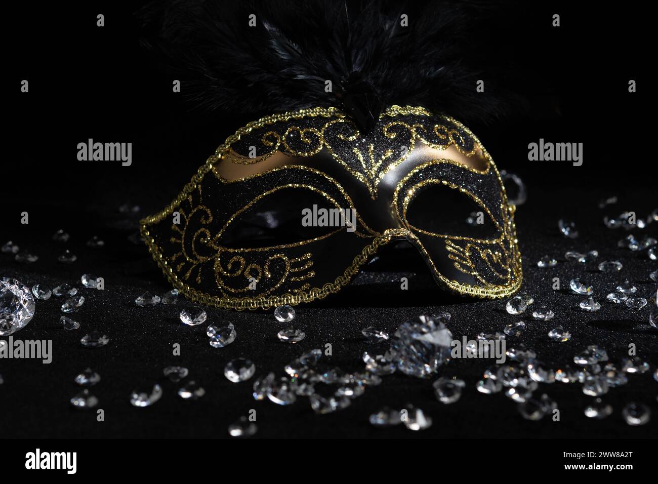 Carnival gold mask with diamonds on black background Stock Photo - Alamy