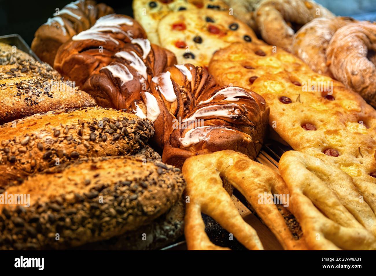 Fresh various pastries in bakery showcase. Sale of baked goods in the ...