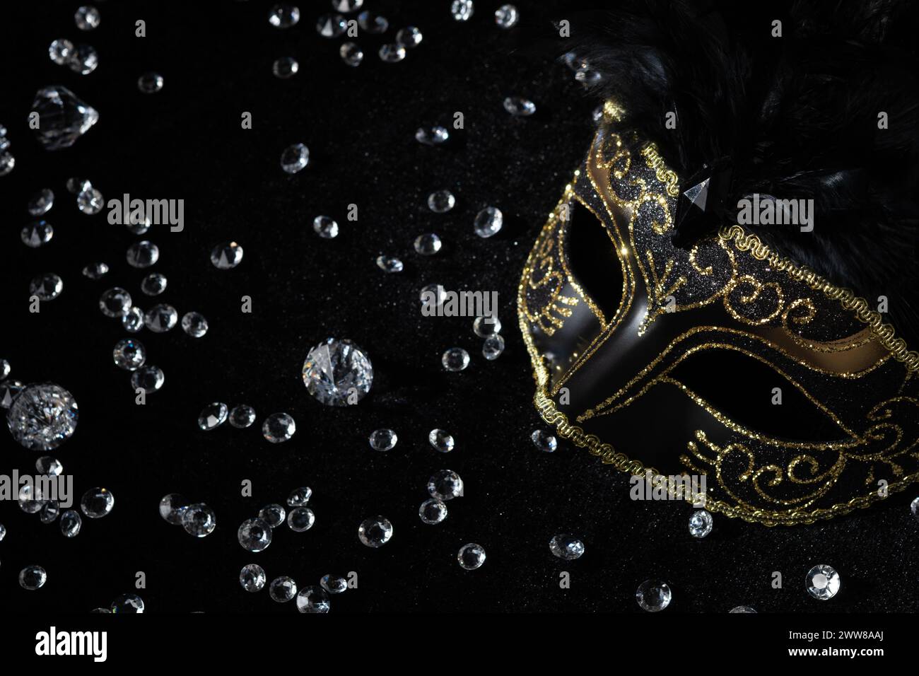 Carnival gold mask with diamonds on black background Stock Photo - Alamy
